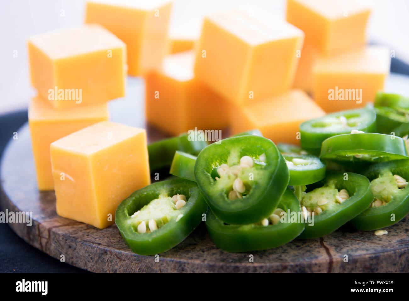 fresh sliced jalapeno peppers and cheddar cheese Stock Photo - Alamy