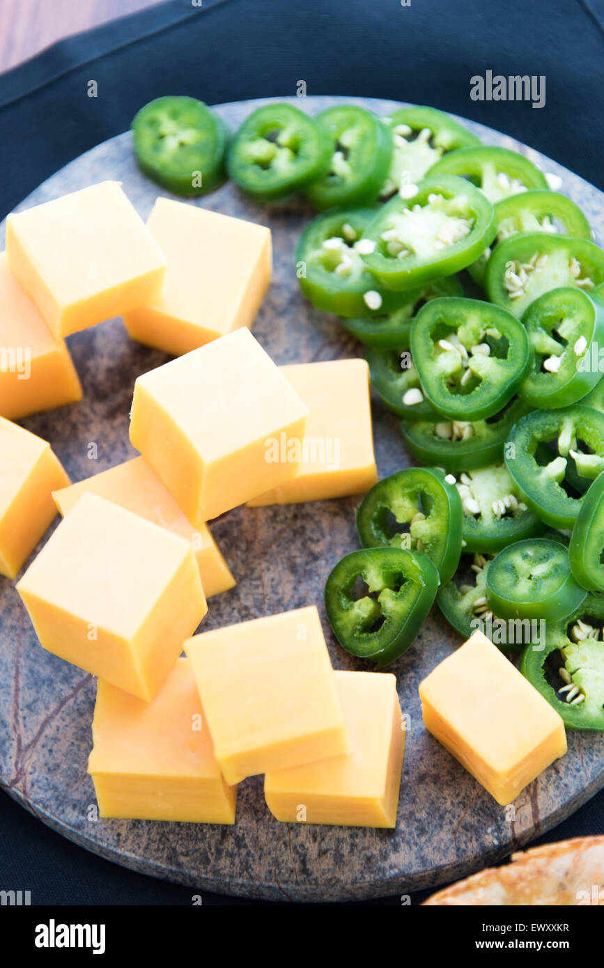 fresh sliced jalapeno peppers and cheddar cheese Stock Photo - Alamy