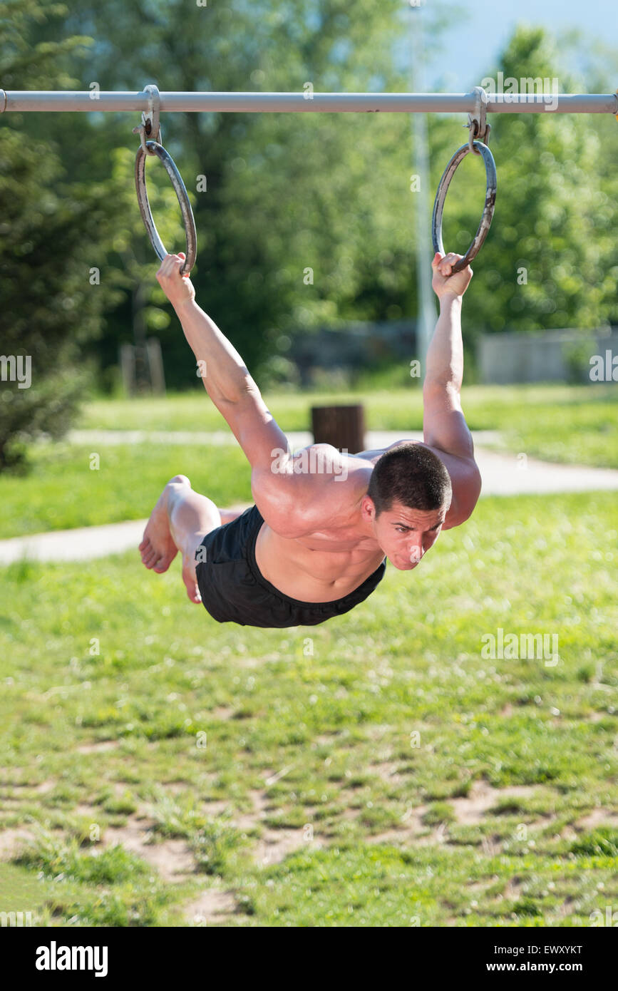 Handsome Muscular Young Man Workout In The Park Stock Photo - Alamy