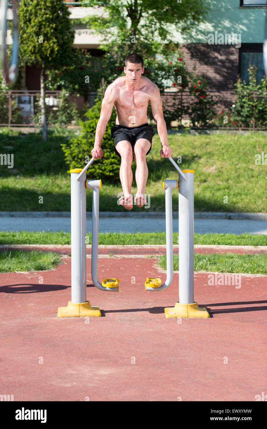 Handsome Muscular Young Man Workout In The Park Stock Photo - Alamy