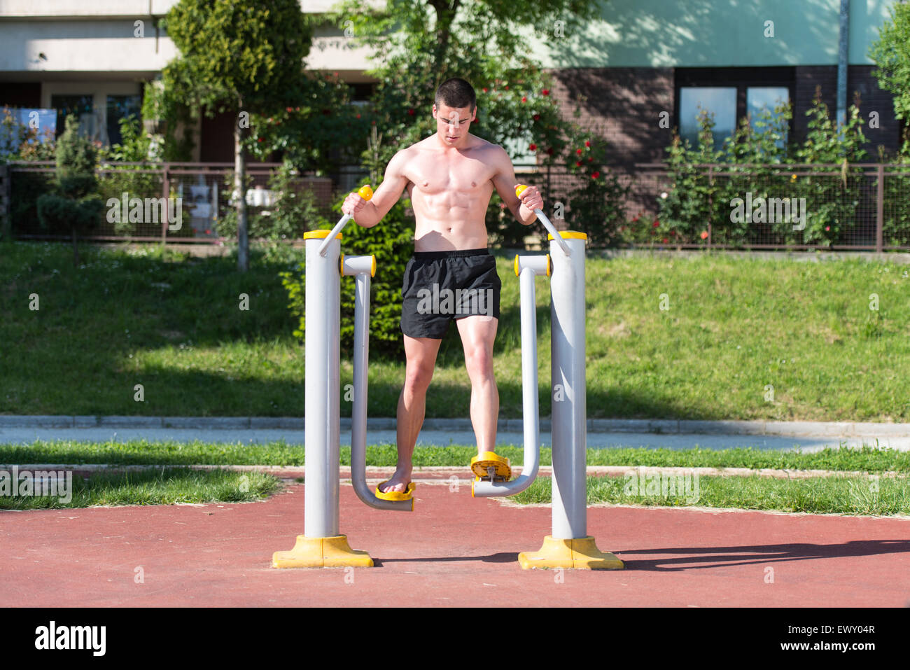 Handsome Muscular Young Man Workout In The Park Stock Photo - Alamy