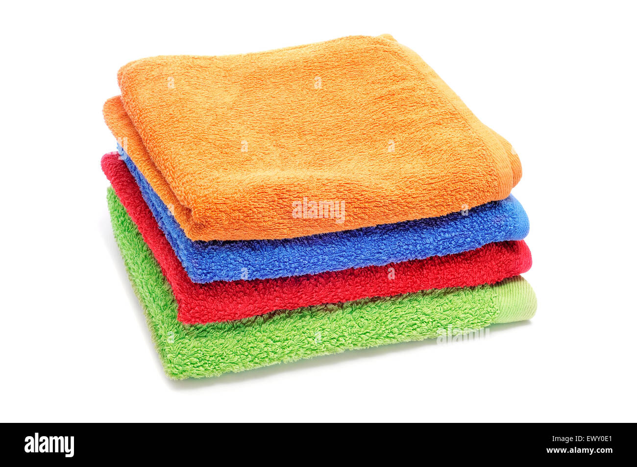 a pile of towels of different colors on a white background Stock Photo ...