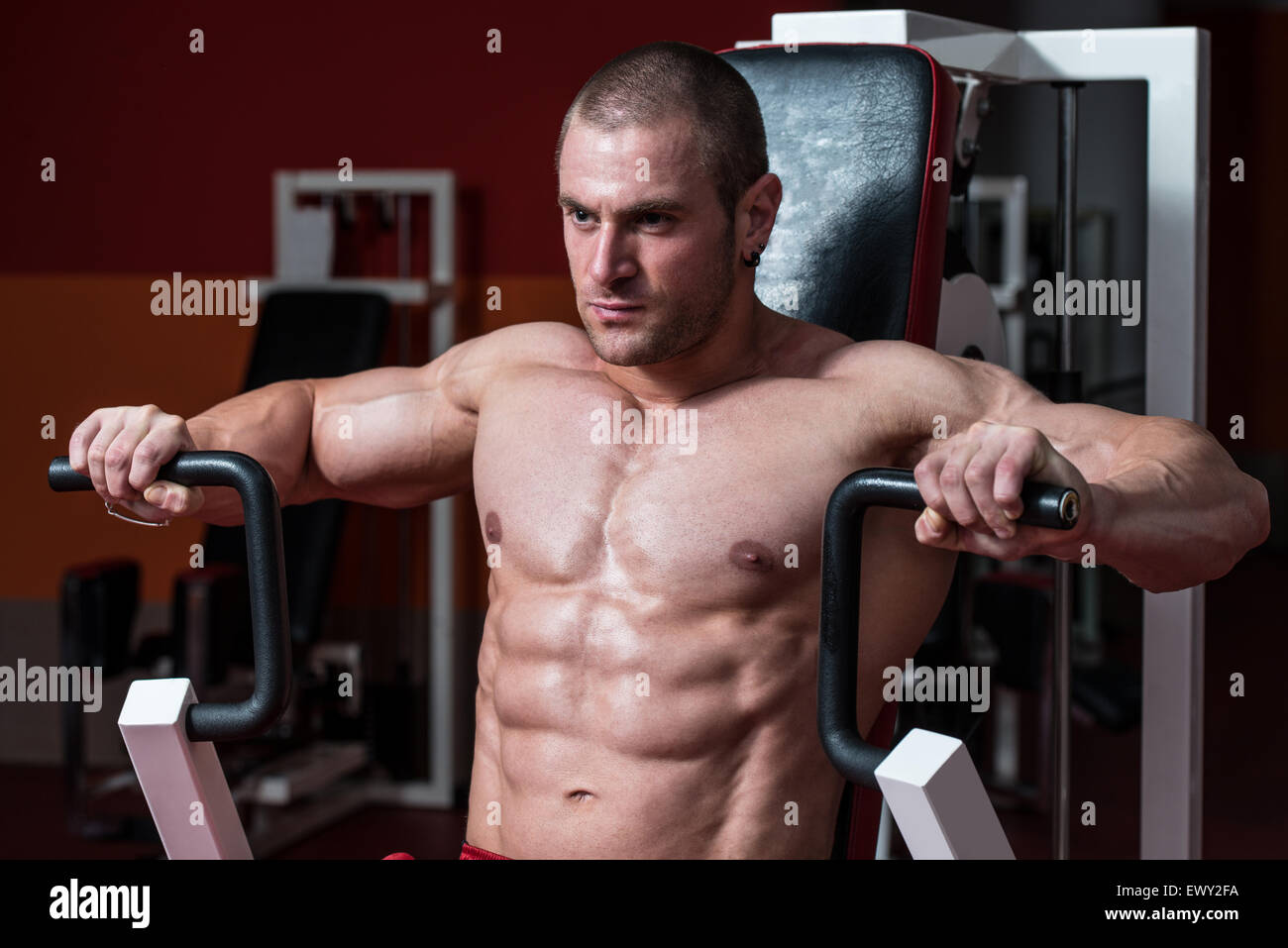 Male Bodybuilder Doing Heavy Weight Exercise For Chest Stock Photo - Alamy