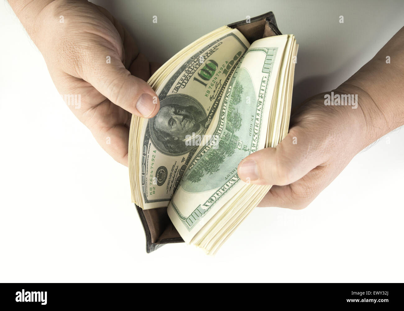 Opening the wallet full of money Stock Photo - Alamy