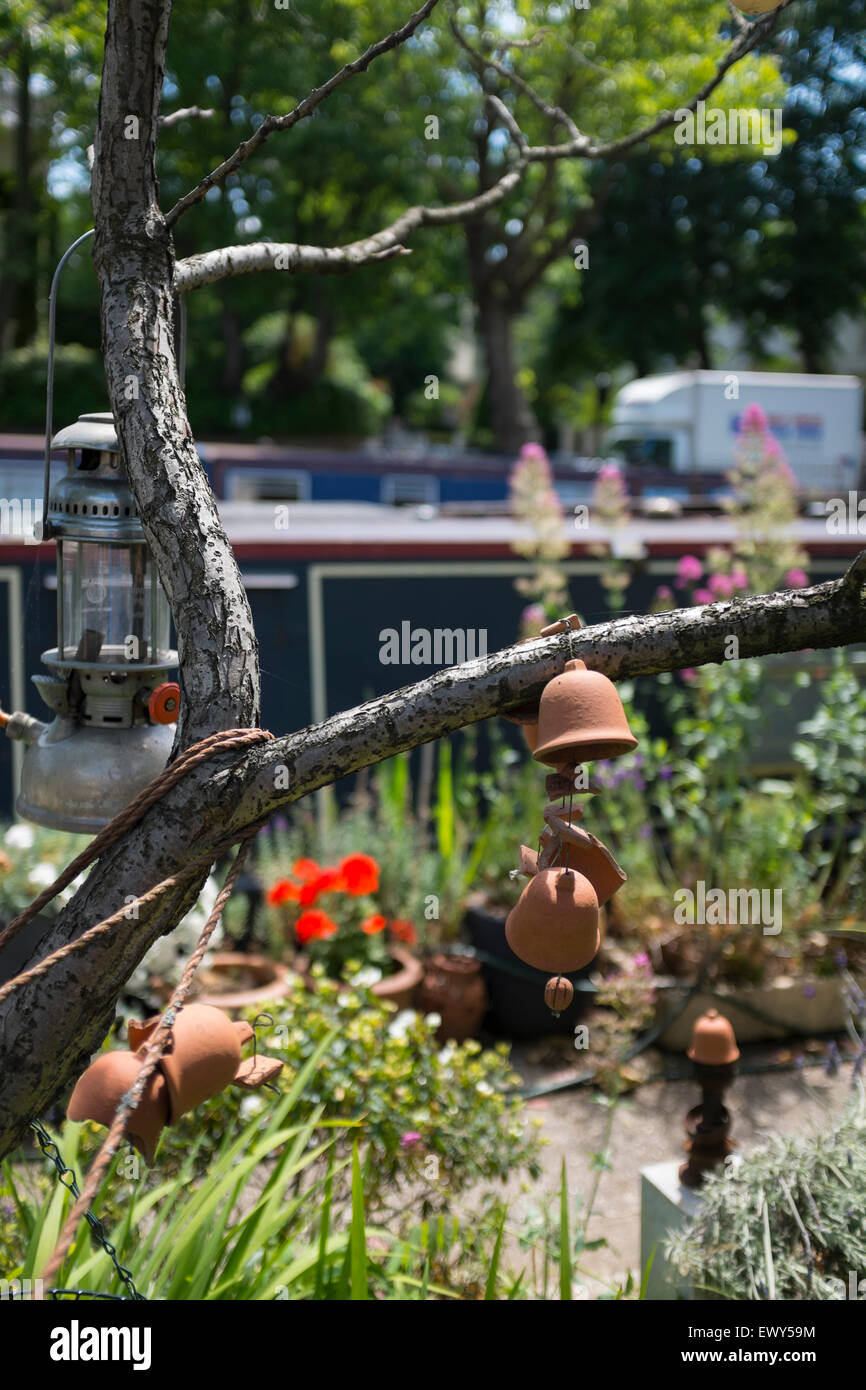 Ceramic wind chime hanging on a tree branch Stock Photo - Alamy