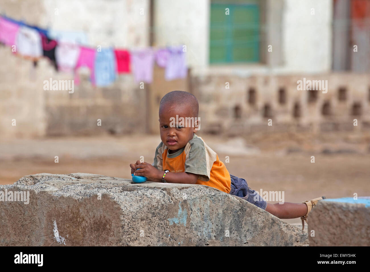 Creole child playing in street at the fishing village Palmeira on the ...