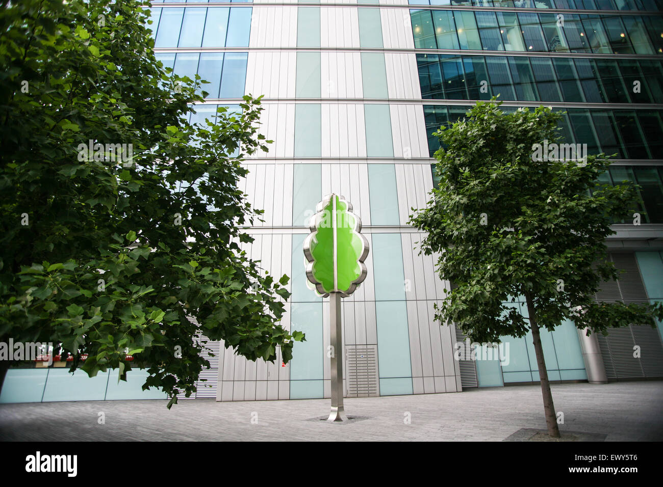 Tree sculpture set amongst the modern office buildings of MoreLondon ...