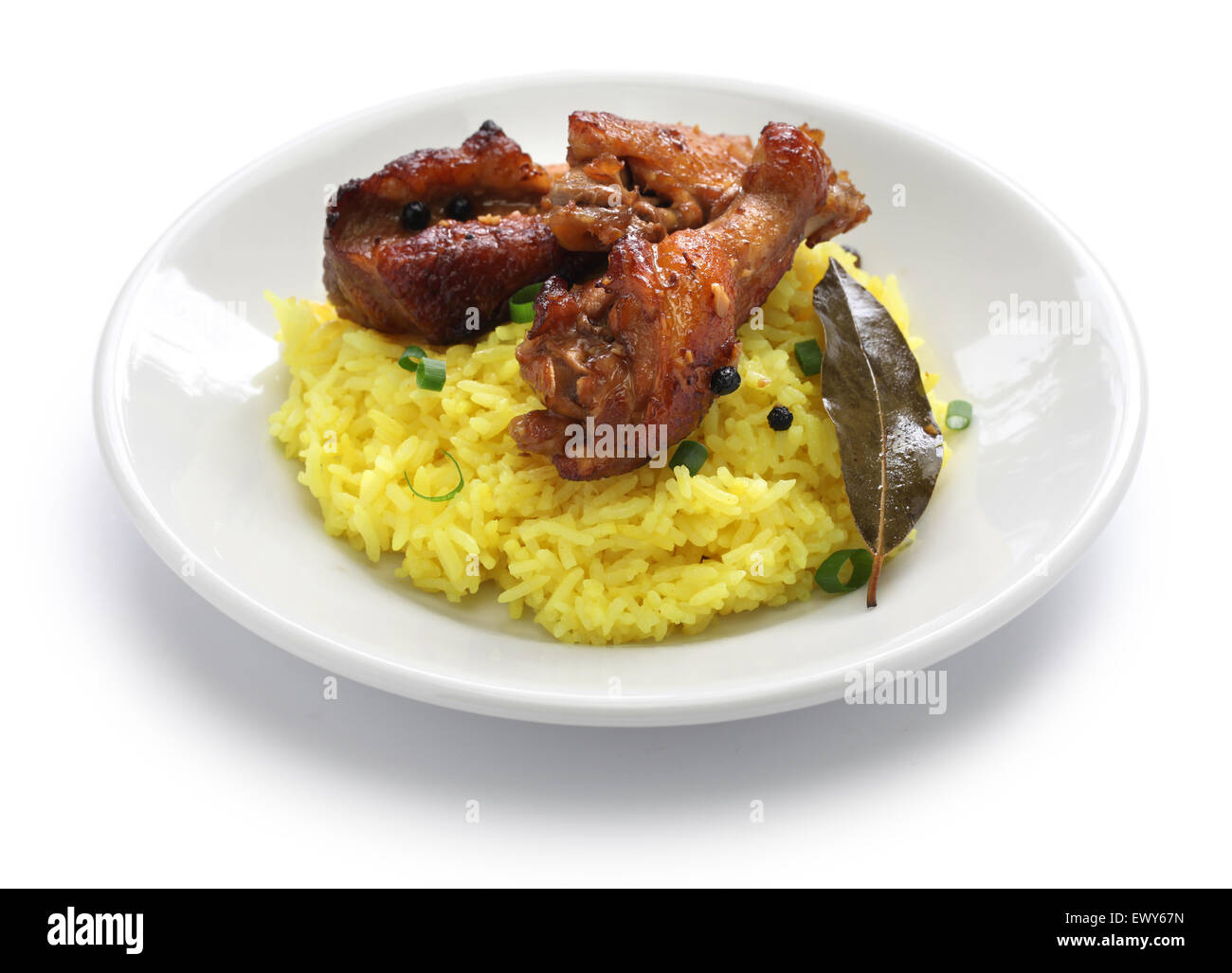 chicken and pork adobo over yellow rice, filipino food Stock Photo - Alamy