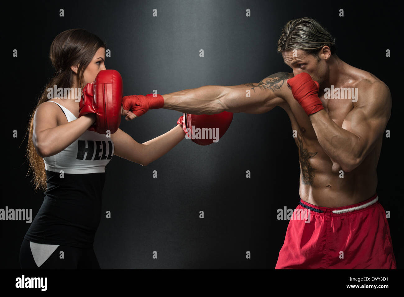 Bodybuilding Couple Posing With Boxing Gloves On Black Background Stock ...