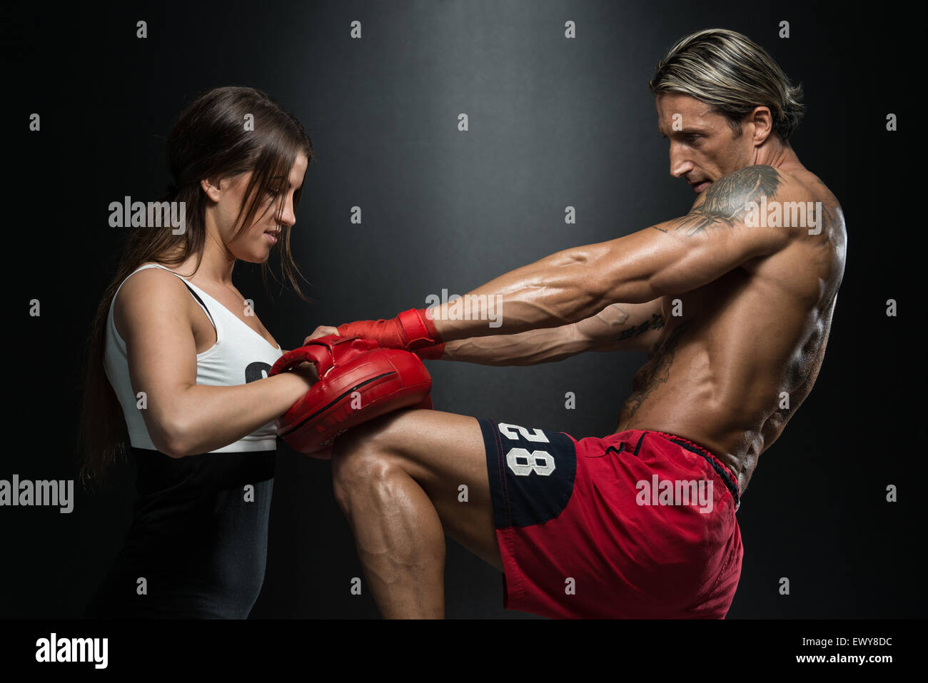 Bodybuilding Couple Posing With Boxing Gloves On Black Background Stock ...