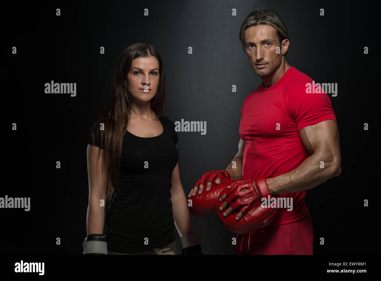Bodybuilding Couple Posing With Boxing Gloves On Black Background Stock ...