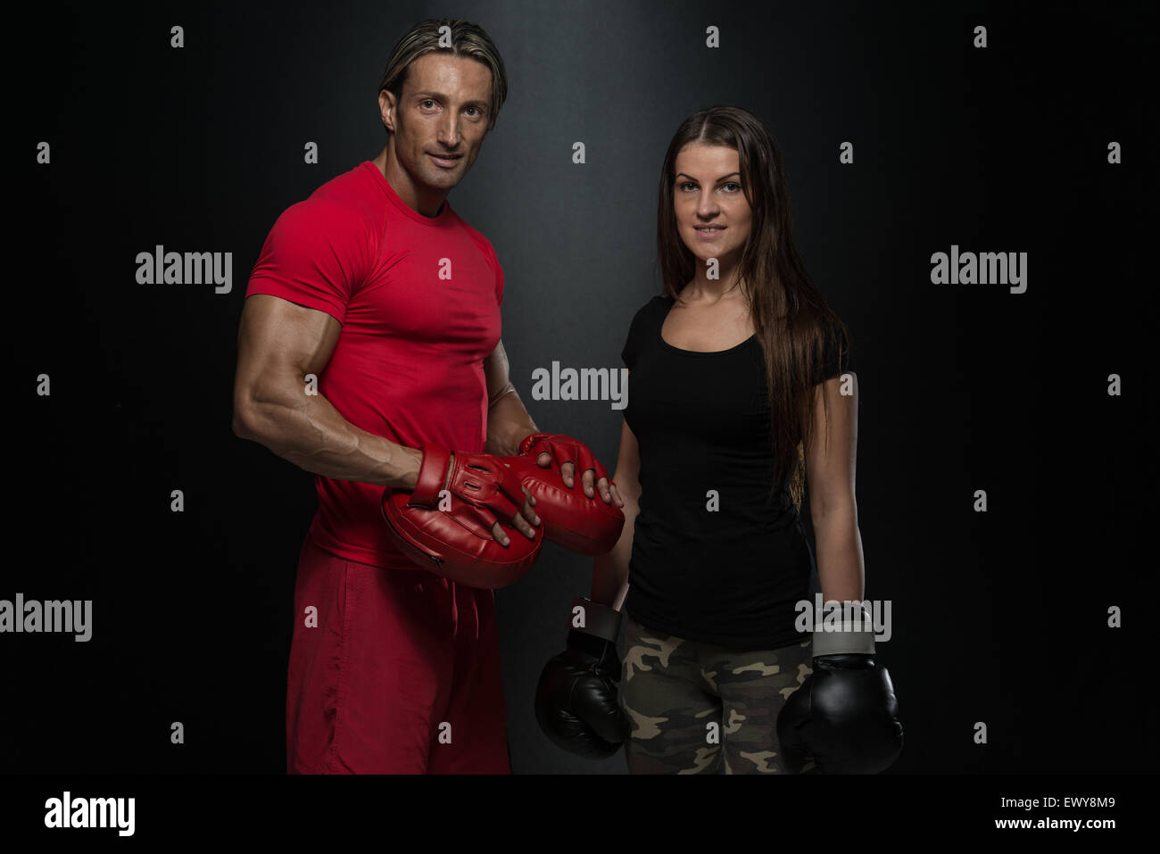 Bodybuilding Couple Posing With Boxing Gloves On Black Background Stock ...