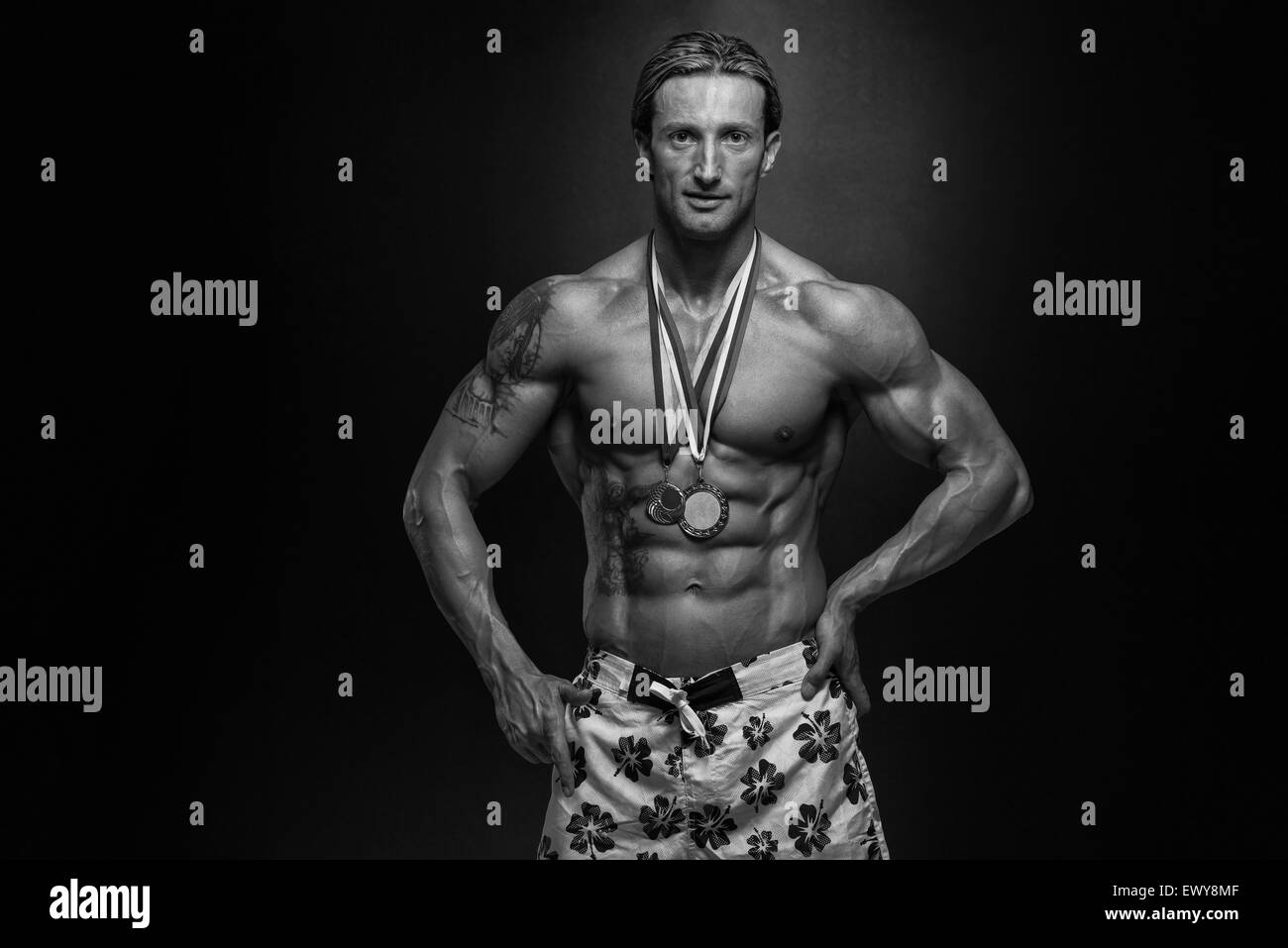 Male Fitness Competitor Showing His Winning Medal Stock Photo - Alamy