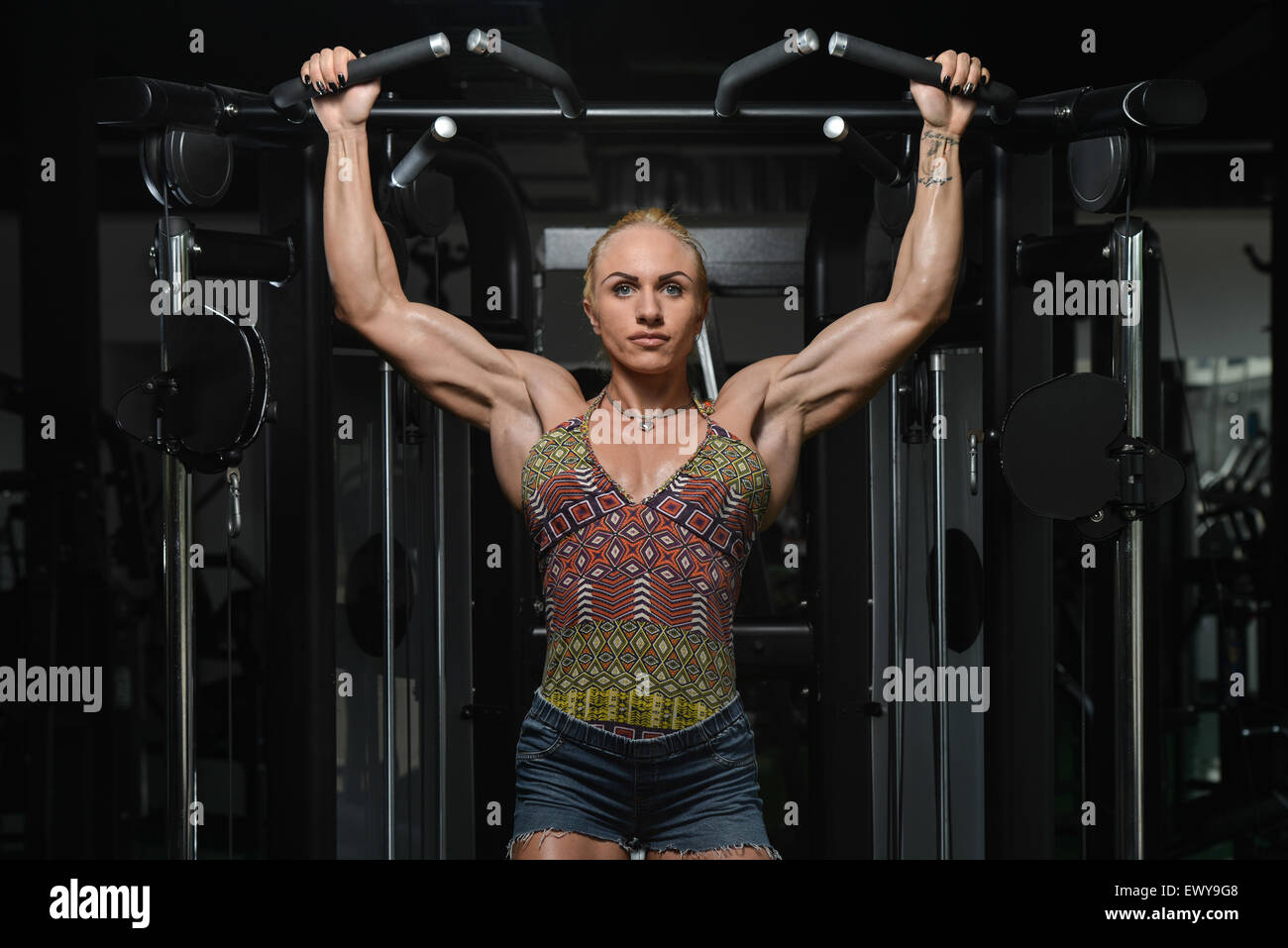 Female Bodybuilder Doing Heavy Weight Exercise For Back In Gym Stock ...