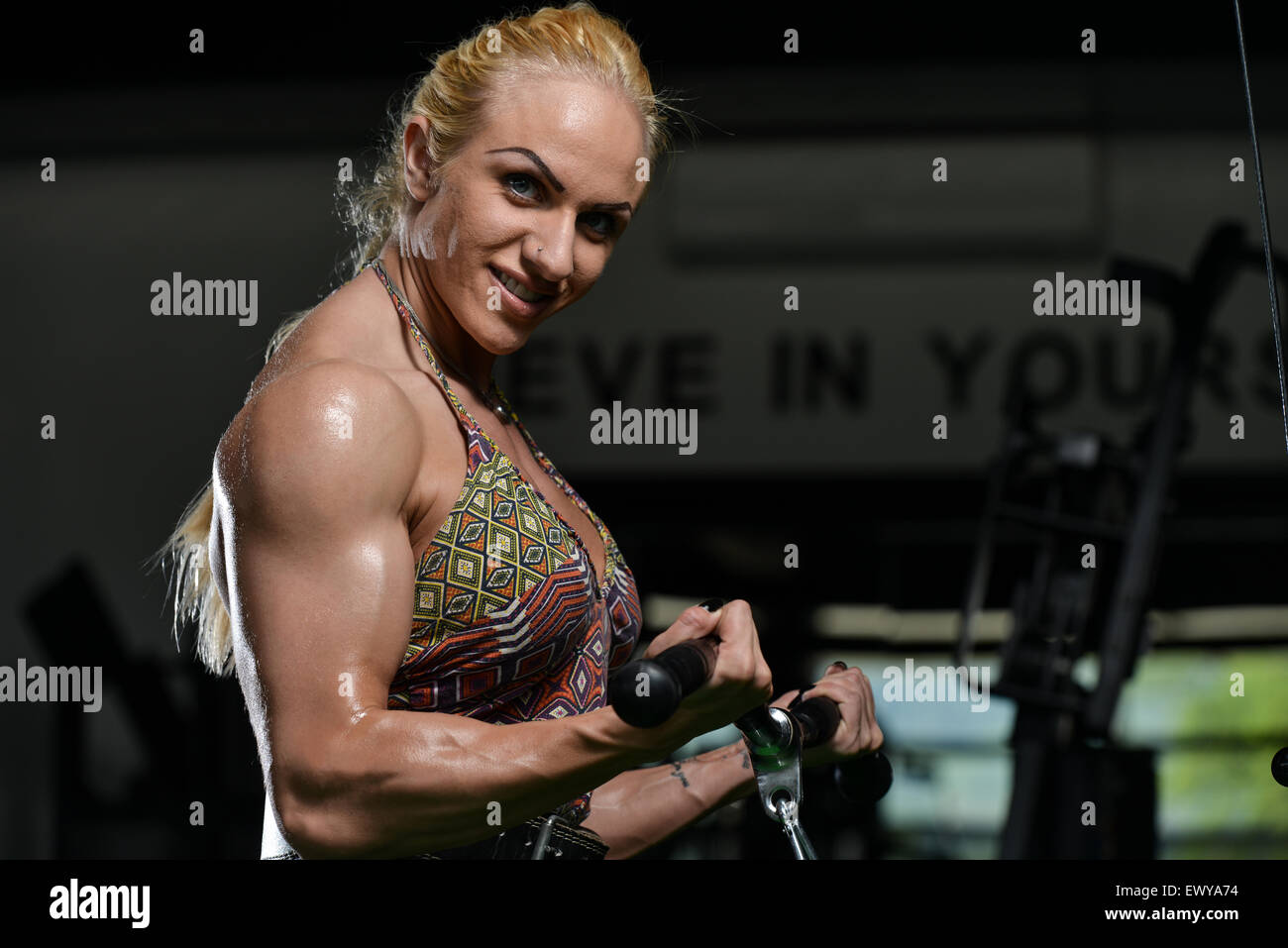 Female Bodybuilder Doing Heavy Weight Exercise For Biceps Stock Photo ...