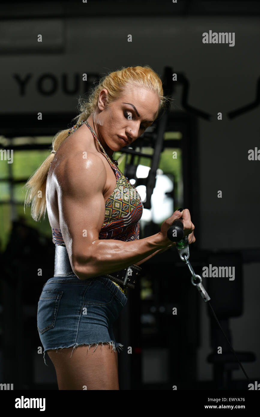 Female Bodybuilder Doing Heavy Weight Exercise For Biceps Stock Photo ...