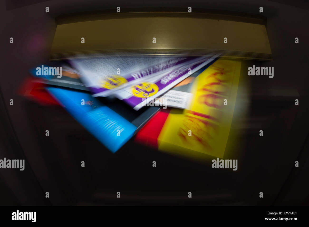 Party leaflets through a letterbox before the 2015 General Election ...