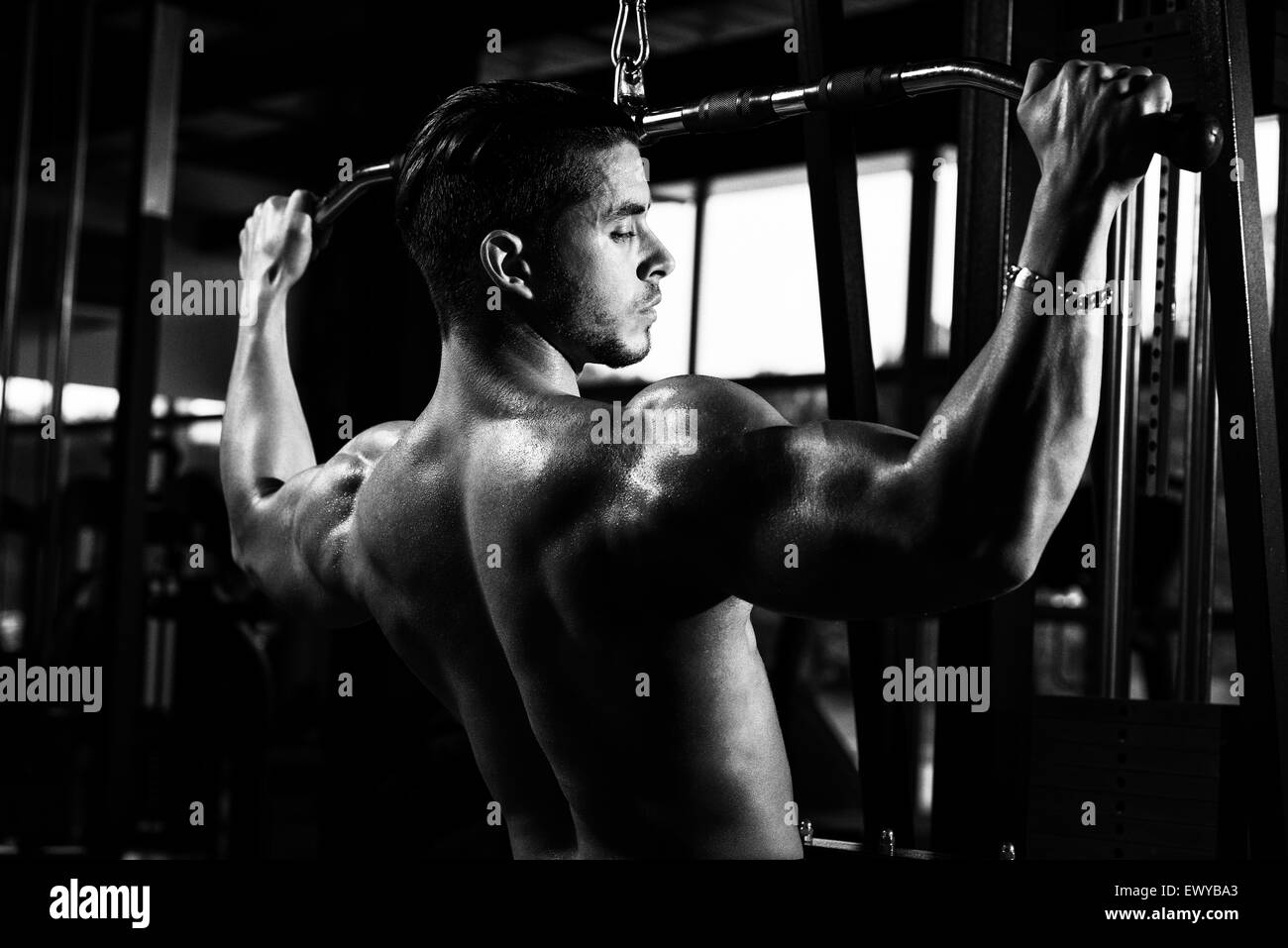 Young Bodybuilder Doing Heavy Weight Exercise For Back In Gym Stock ...