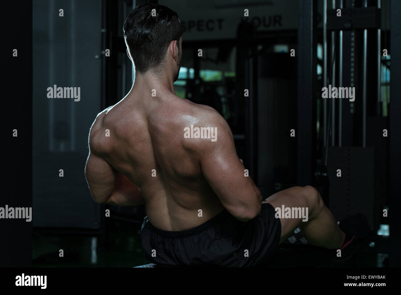 Young Bodybuilder Doing Heavy Weight Exercise For Back In Gym Stock ...