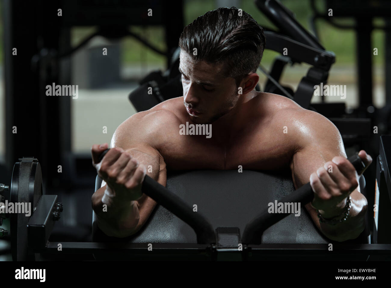 Male Bodybuilder Doing Heavy Weight Exercise For Biceps Stock Photo - Alamy