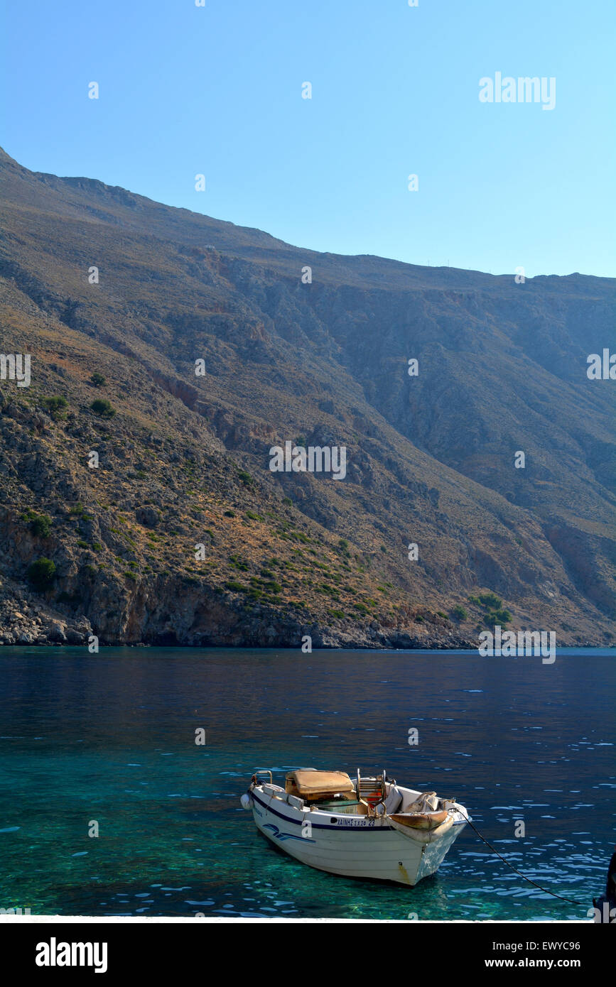 A fishing boat on the sea near Loutro, Crete with the Lefki Ora ...