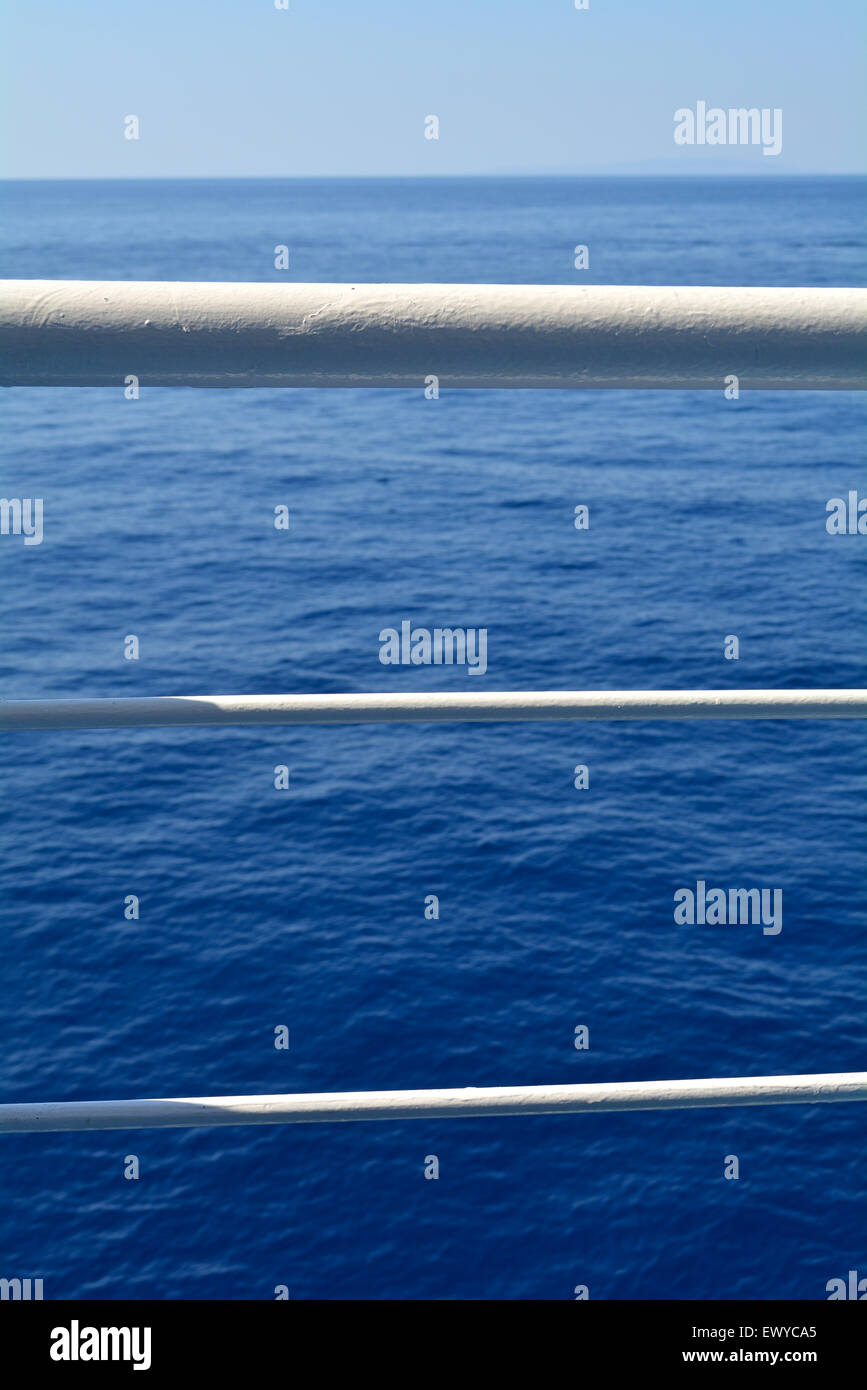 Three horizontal railings on a Greek ferry sailing in the Mediterranean ...
