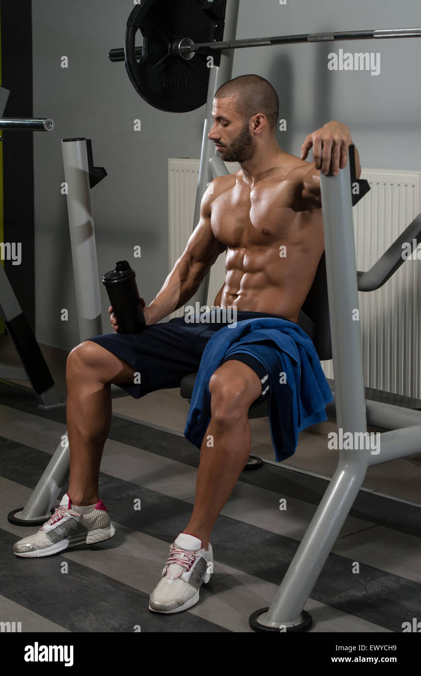 Muscular Man Resting After Exercise And Drinking From Shaker Stock ...