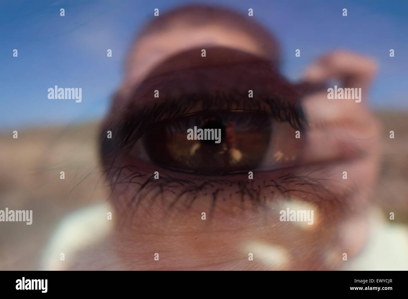"Photographers eye" conceptual image. Eye reflected on glass surface ...