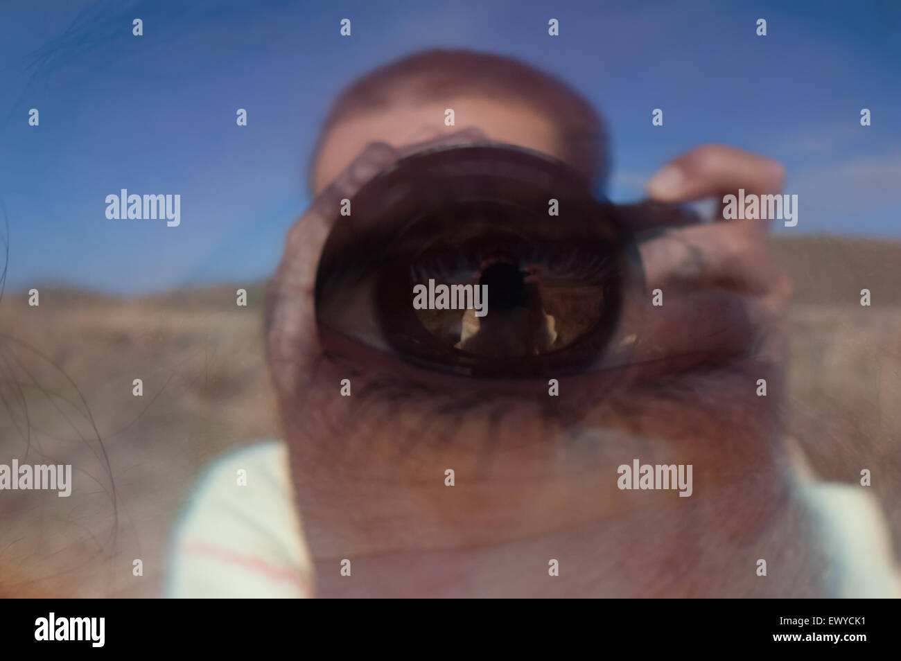 "Photographers eye" conceptual image. Eye reflected on glass surface ...