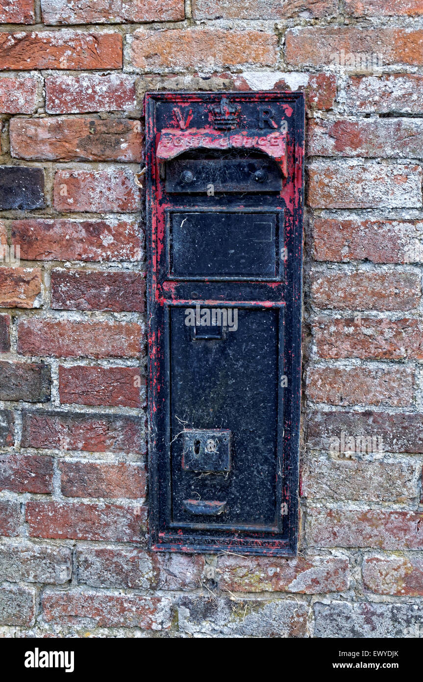 Blocked rural post box in wall Stock Photo - Alamy