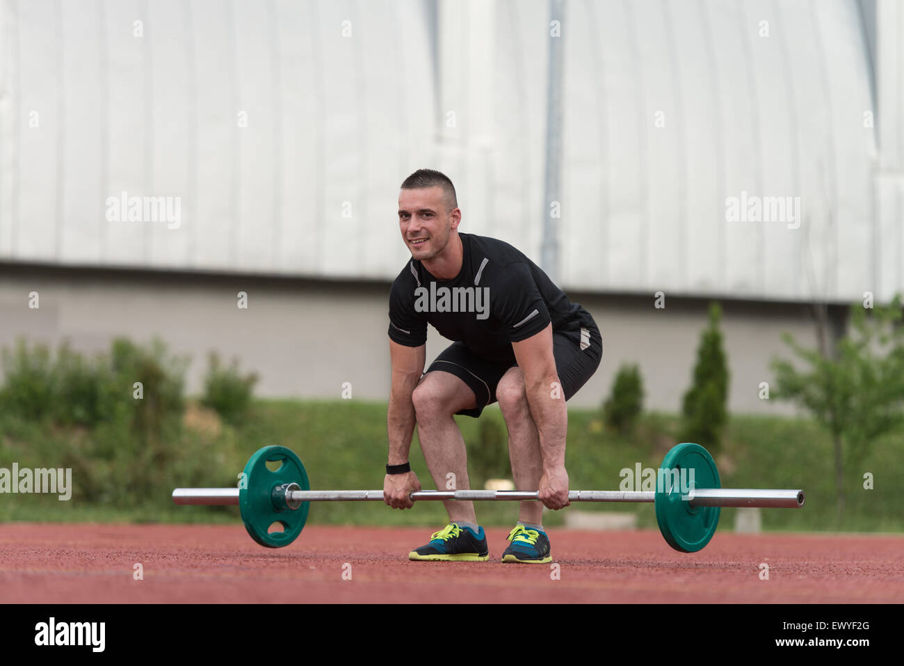 Young Man Doing A Dead Lift Exercise Outdoor Stock Photo - Alamy