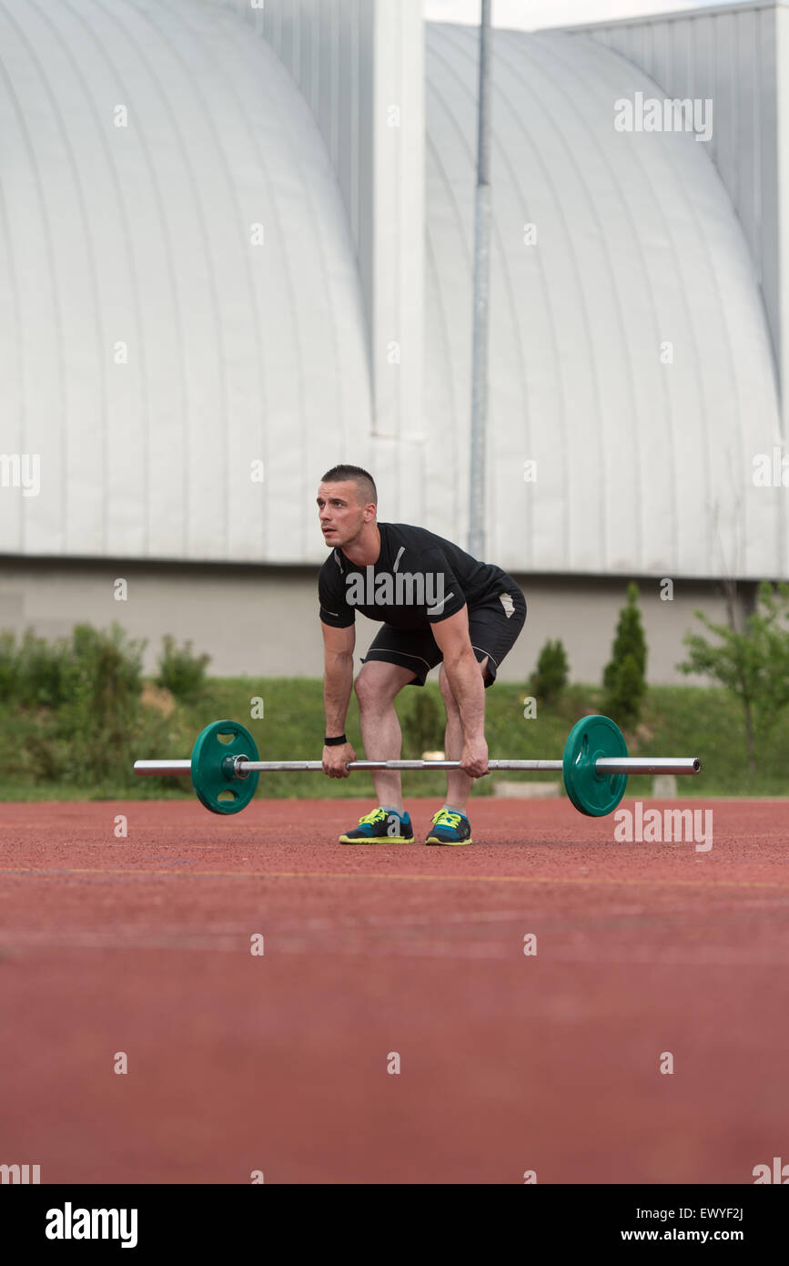 Young Man Doing A Dead Lift Exercise Outdoor Stock Photo - Alamy