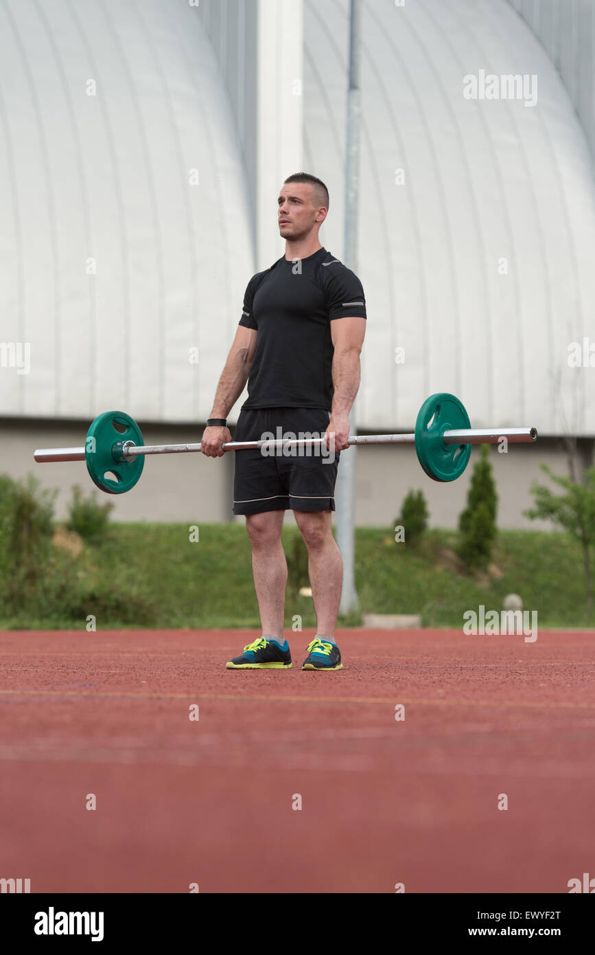 Young Man Doing A Dead Lift Exercise Outdoor Stock Photo - Alamy