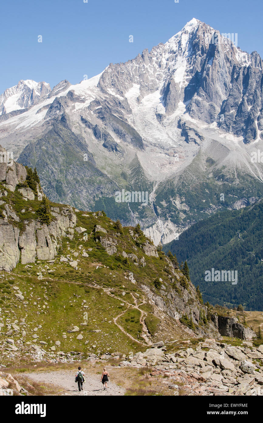 Hikers above Chamonix-Mont Blanc valley, France. Mont Blanc massif ...