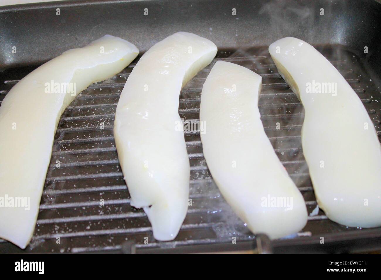 slices of grilled squid Stock Photo - Alamy