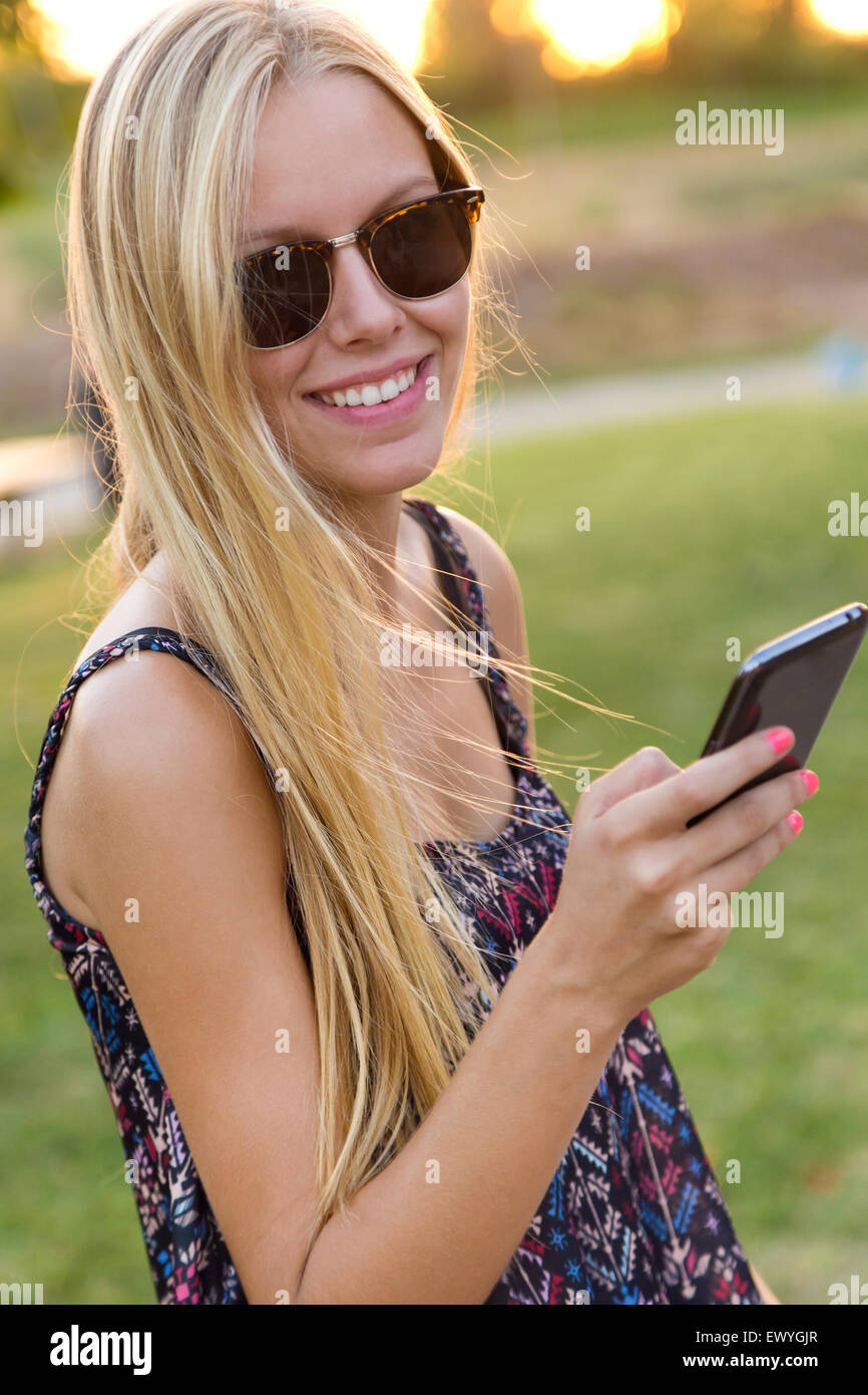 Blond woman texting hi-res stock photography and images - Alamy
