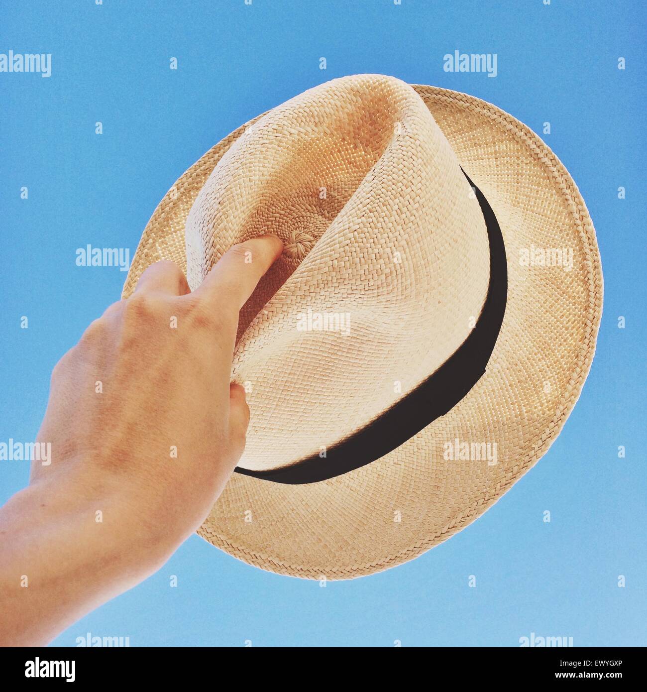 Hand holding hat hi-res stock photography and images - Alamy
