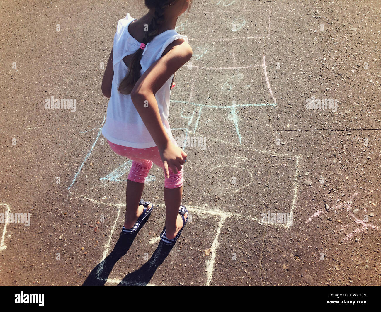 Girl Playing Hopscotch Stock Photo - Alamy