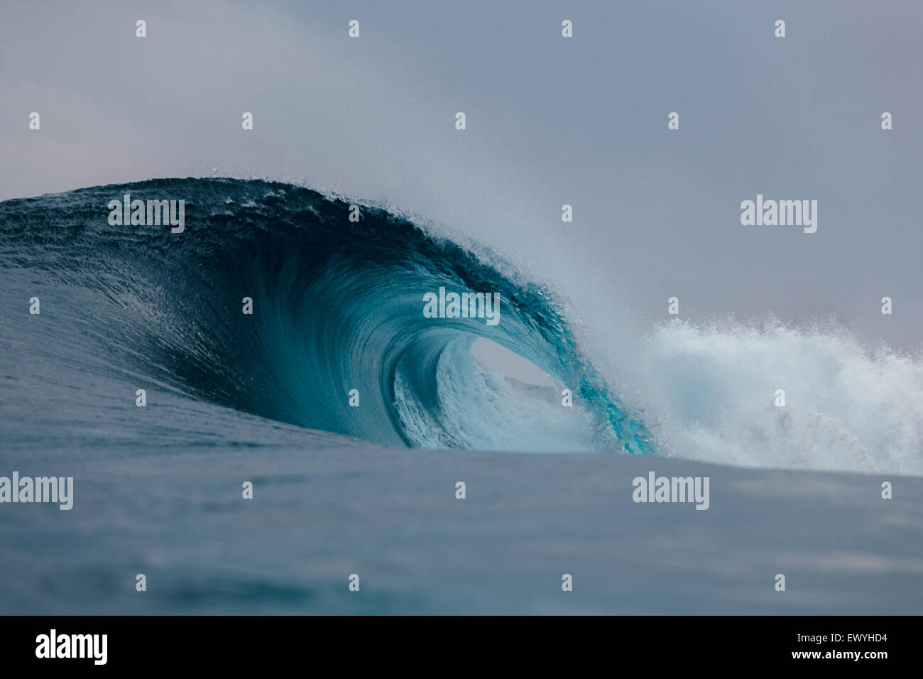 A blue wave breaking on north shore of oahu hi-res stock photography ...