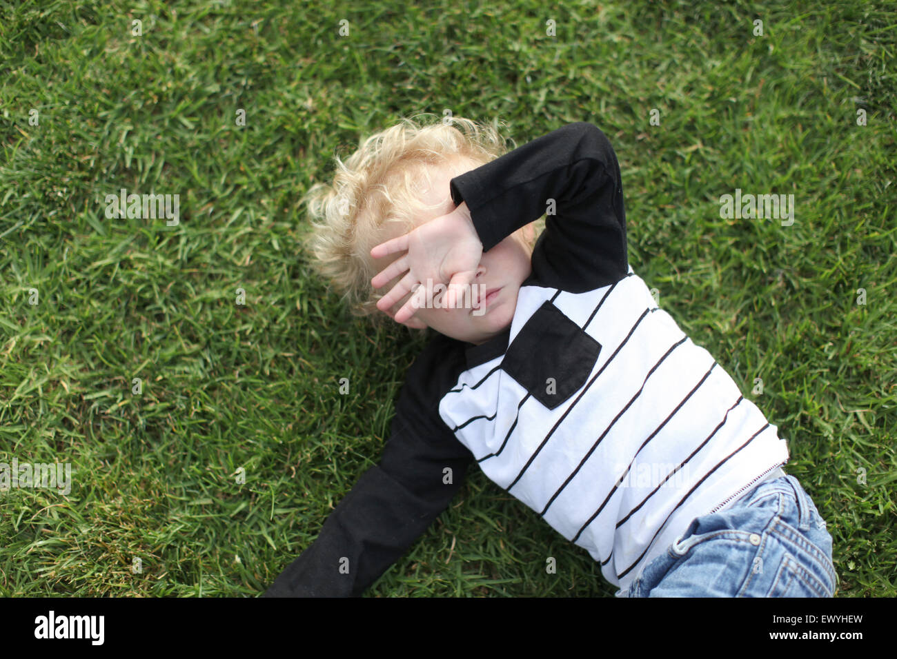 Boy on the ground hi-res stock photography and images - Alamy