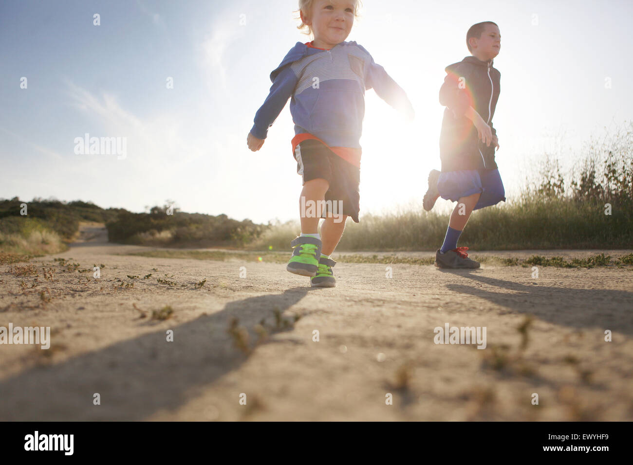 Boys running hi-res stock photography and images - Alamy