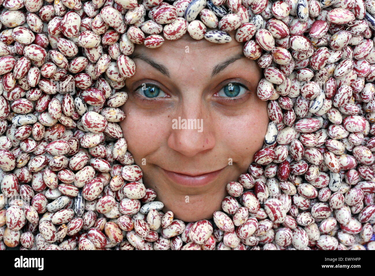Woman's face surrounded by beans Stock Photo - Alamy