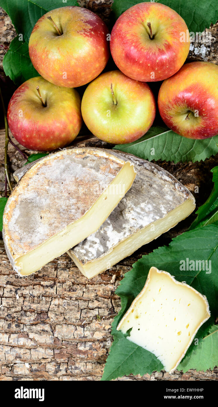 french cheeses with apples in the background Stock Photo - Alamy
