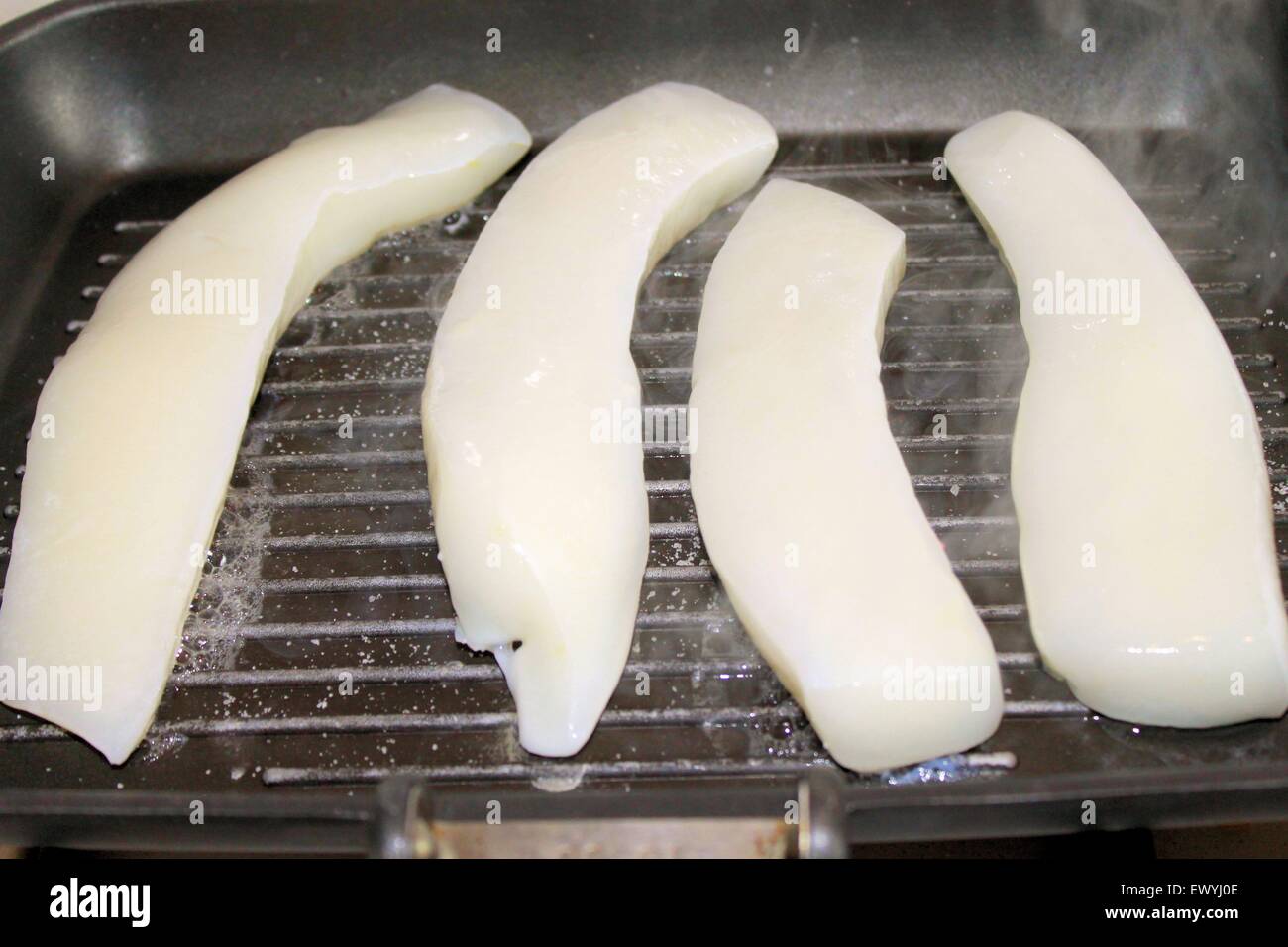 slices of grilled squid Stock Photo - Alamy