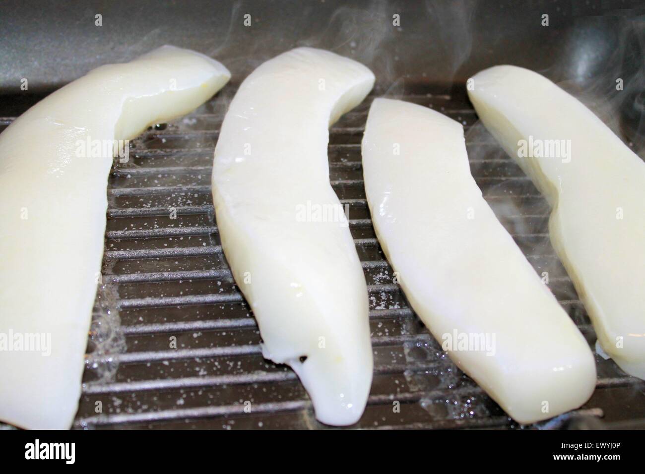 slices of grilled squid Stock Photo - Alamy