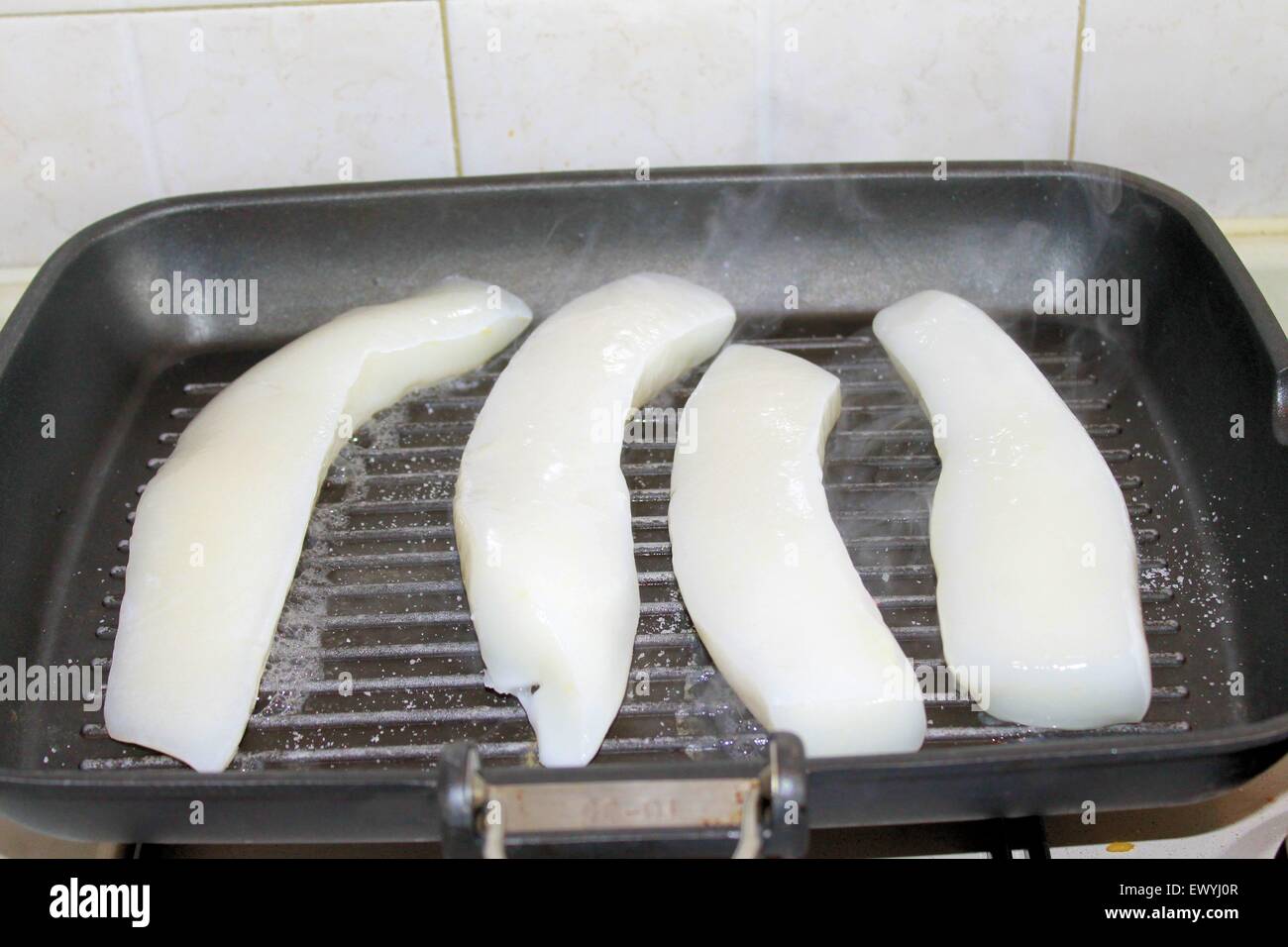 slices of grilled squid Stock Photo - Alamy