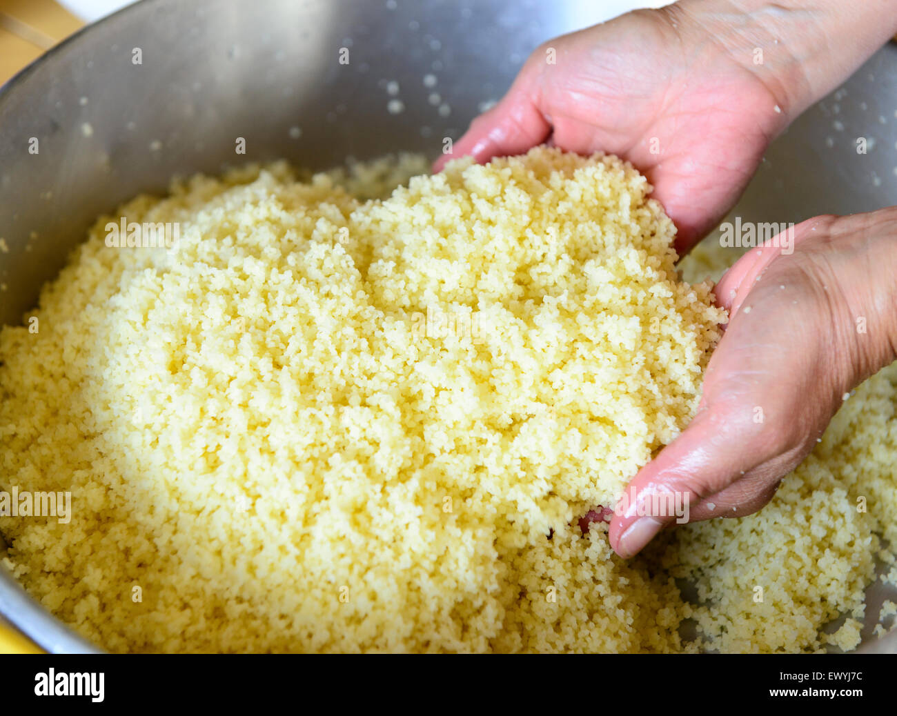 preparation of couscous with semolina Stock Photo - Alamy