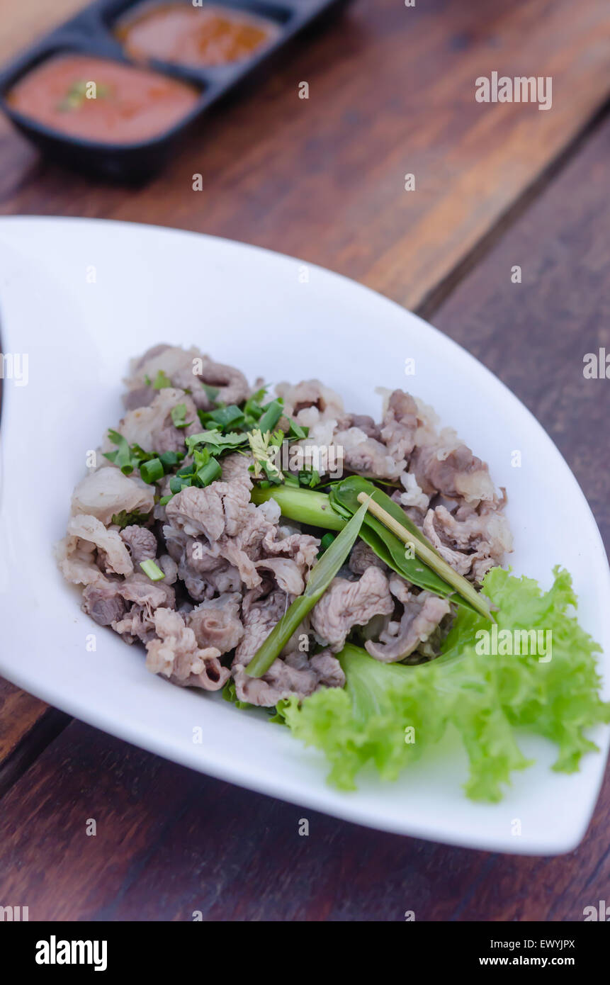 Blanched beef served with fresh green vegetable Stock Photo - Alamy