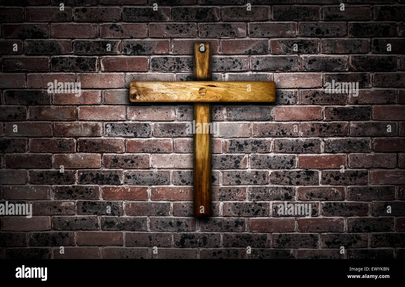 Wooden crucifix hanging on a brick wall Stock Photo - Alamy