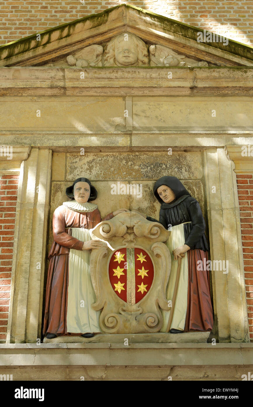 A bas relief depiction of women in medieval clothing in Gouda, the ...